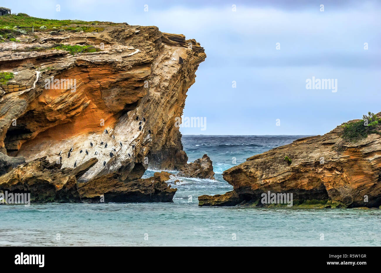The sharp rocks on the Australian coast of the Pacific ocean Stock ...