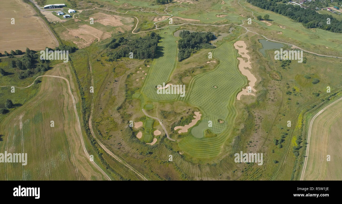 Aerial view Golf course with green grass and ponds. Golf field in the ...