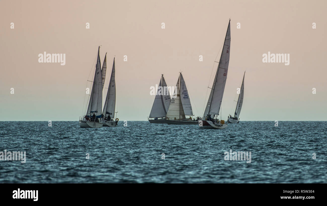 Sails over horizon. Sailboats racing in regatta, Irish Sea Stock Photo ...