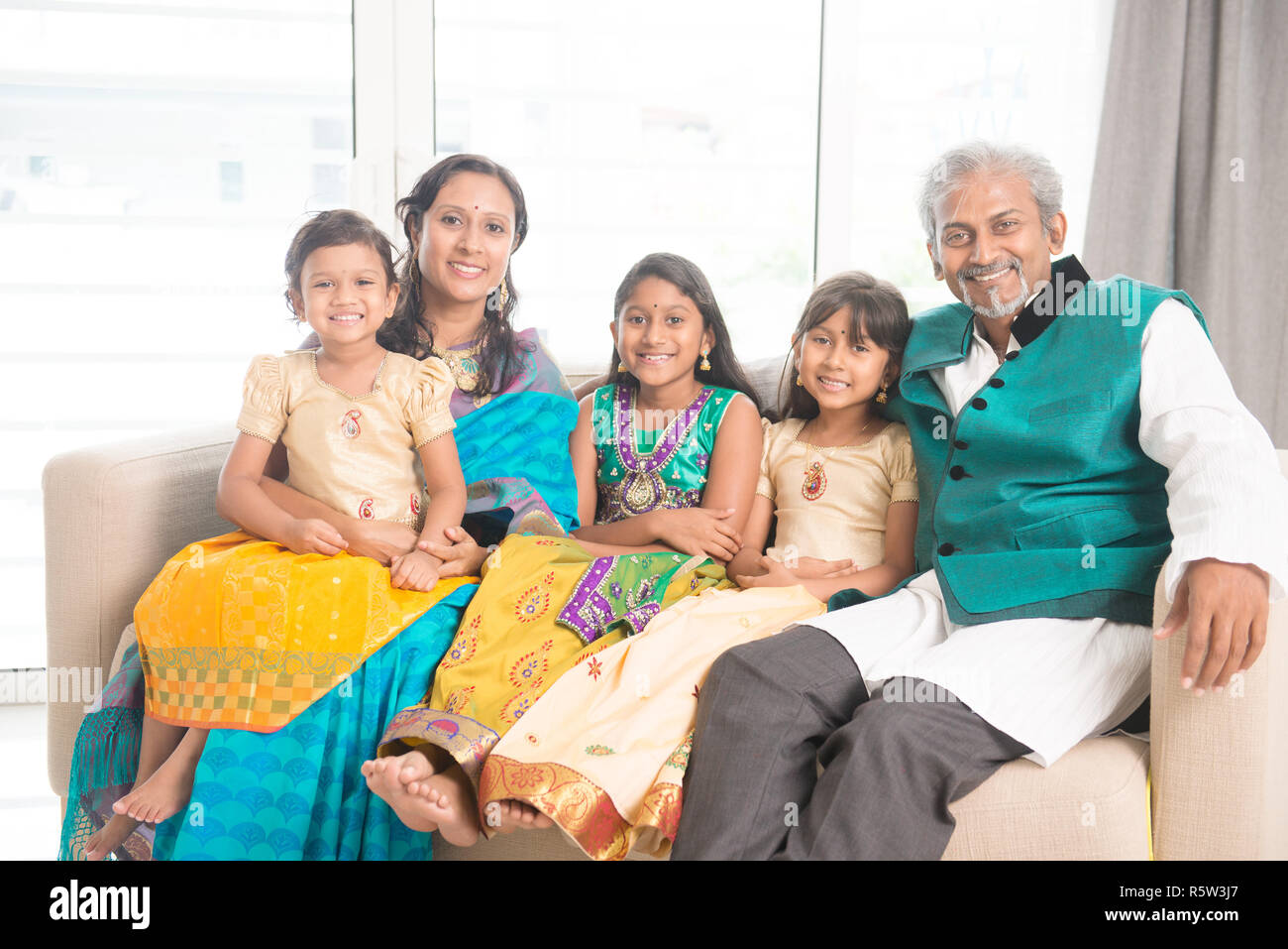 Indian family of five smile at camera Stock Photo - Alamy