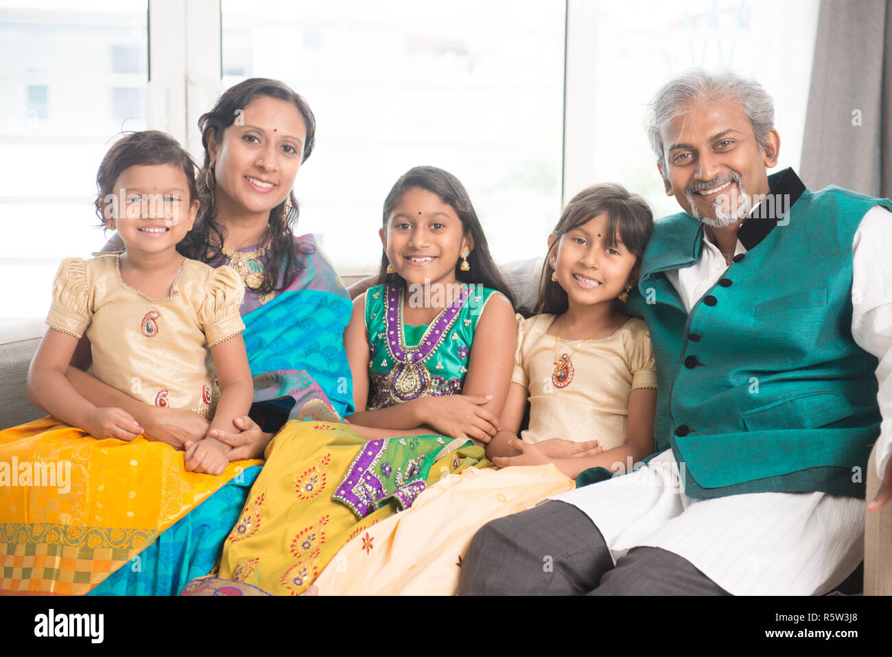 Family of five smile at camera Stock Photo - Alamy