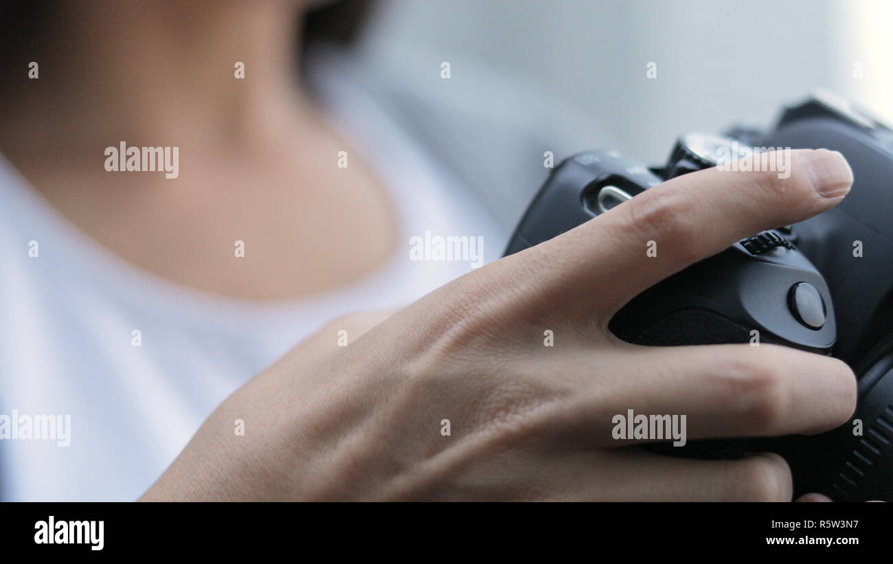 Female Photographer using digital camera Stock Photo - Alamy