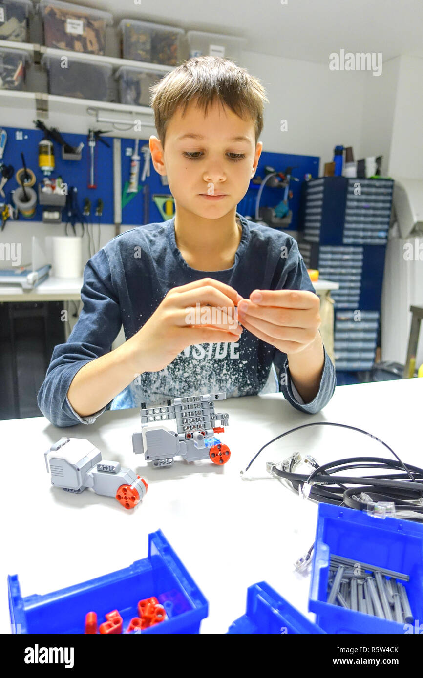 Vilnius, Lithuania - November 23, 2018: Kid making Lego robot ...