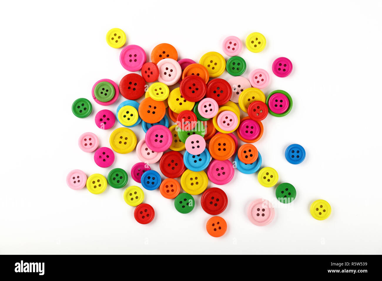 Mix of round colorful sewing buttons on white Stock Photo - Alamy