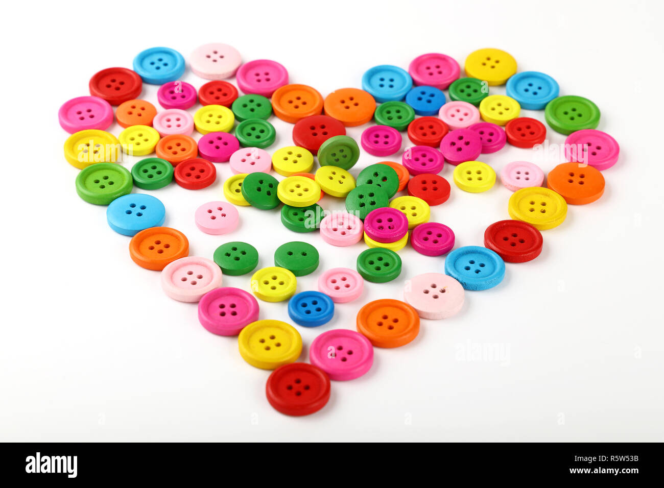Heart shaped of colorful sewing buttons on white Stock Photo - Alamy