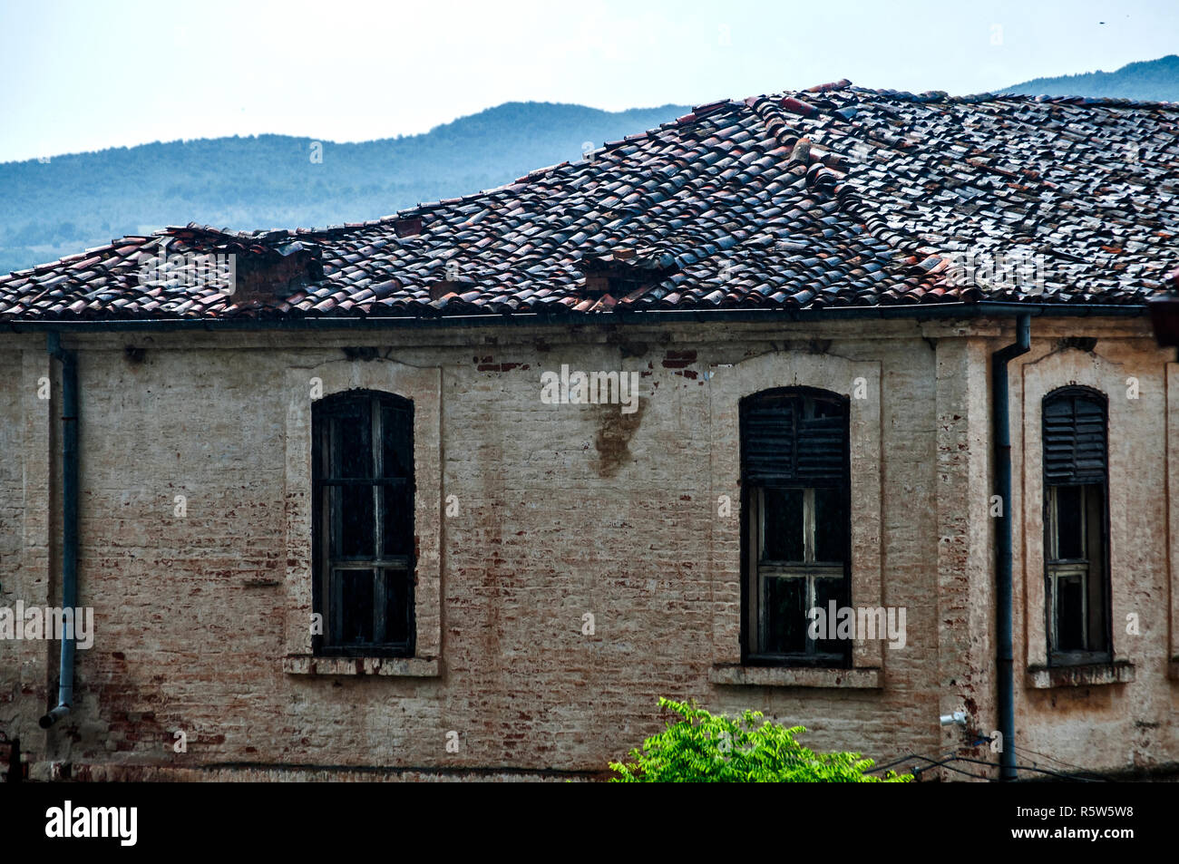Old vintage country house in rainy wet weather Stock Photo - Alamy