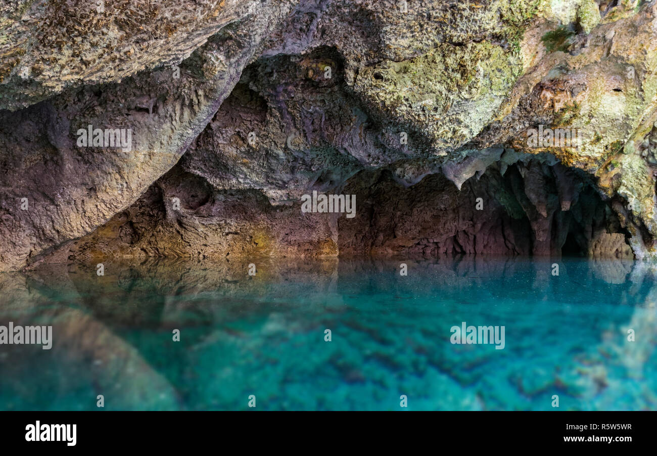Blue water and rock Stock Photo - Alamy