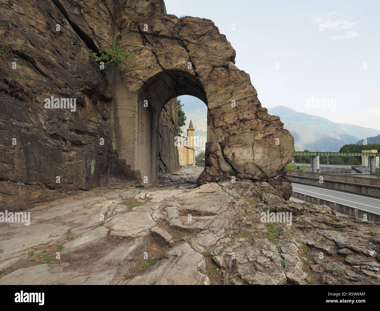 Ancient roman road arch in Donnas Stock Photo - Alamy