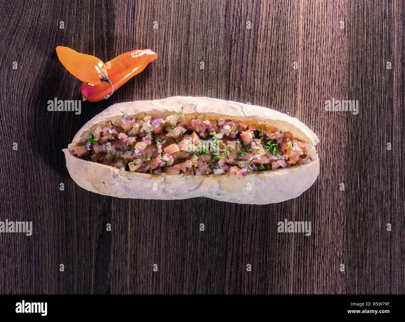 Choripan with chopped tamato capture one Stock Photo - Alamy