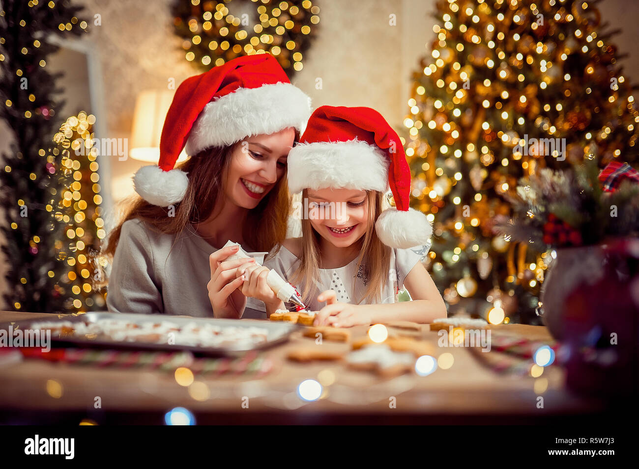 Merry Christmas and Happy Holidays. Family preparation holiday food ...