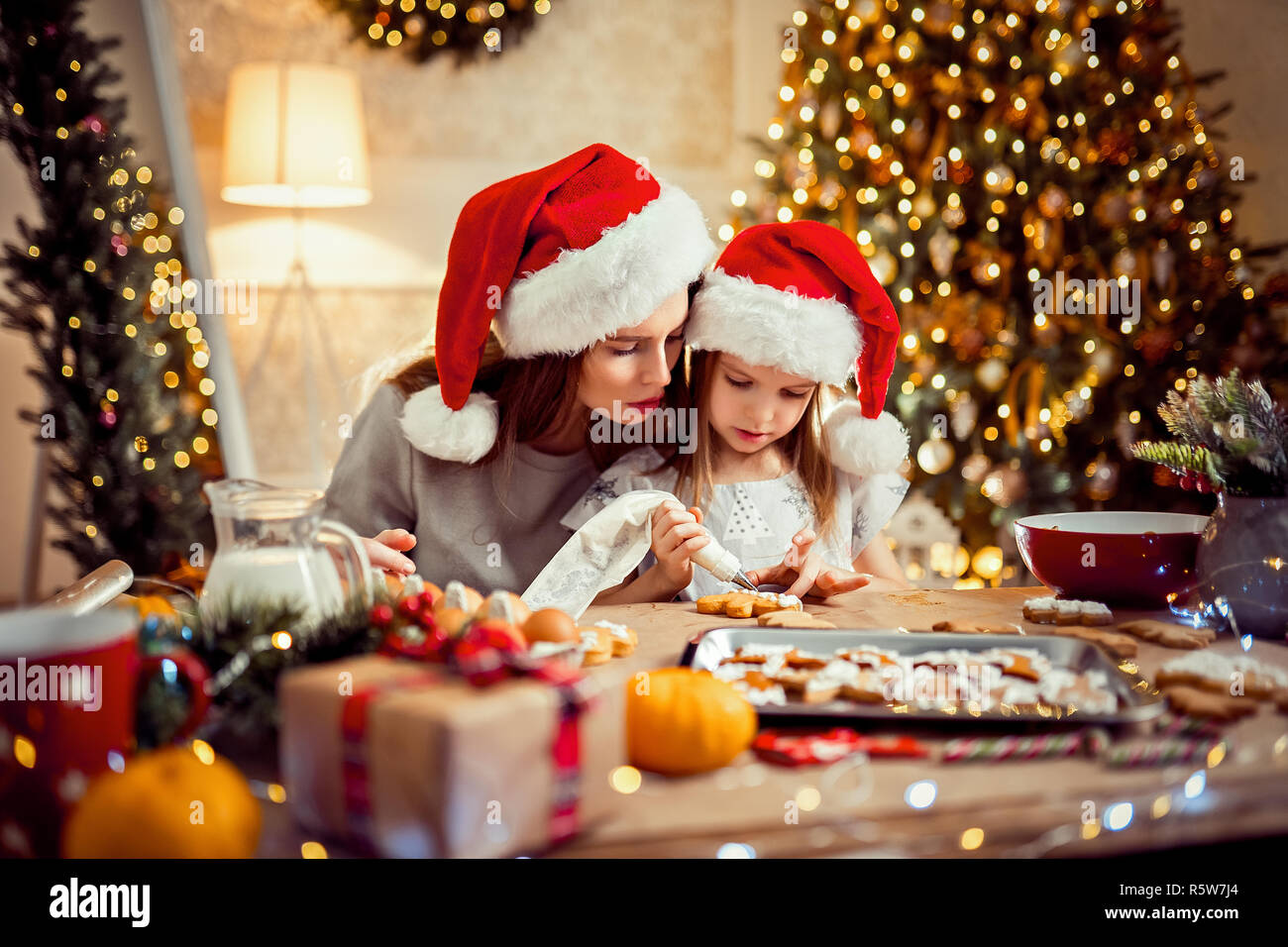 Merry Christmas and Happy Holidays. Family preparation holiday food ...