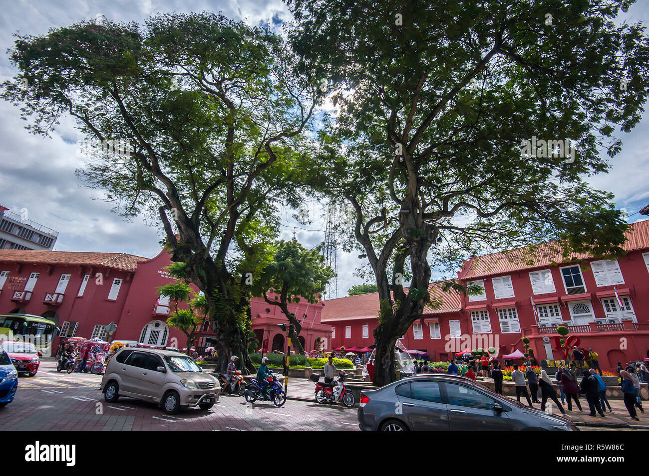 Dutch Square is surrounded by red painted buildings. It reflects the ...