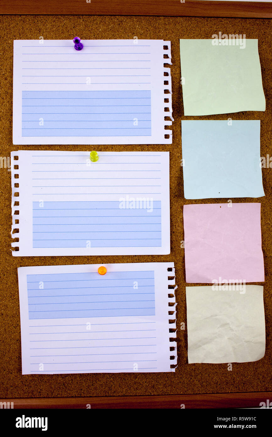 Lined note paper with sticky tape. Paper piece on white notice board ...
