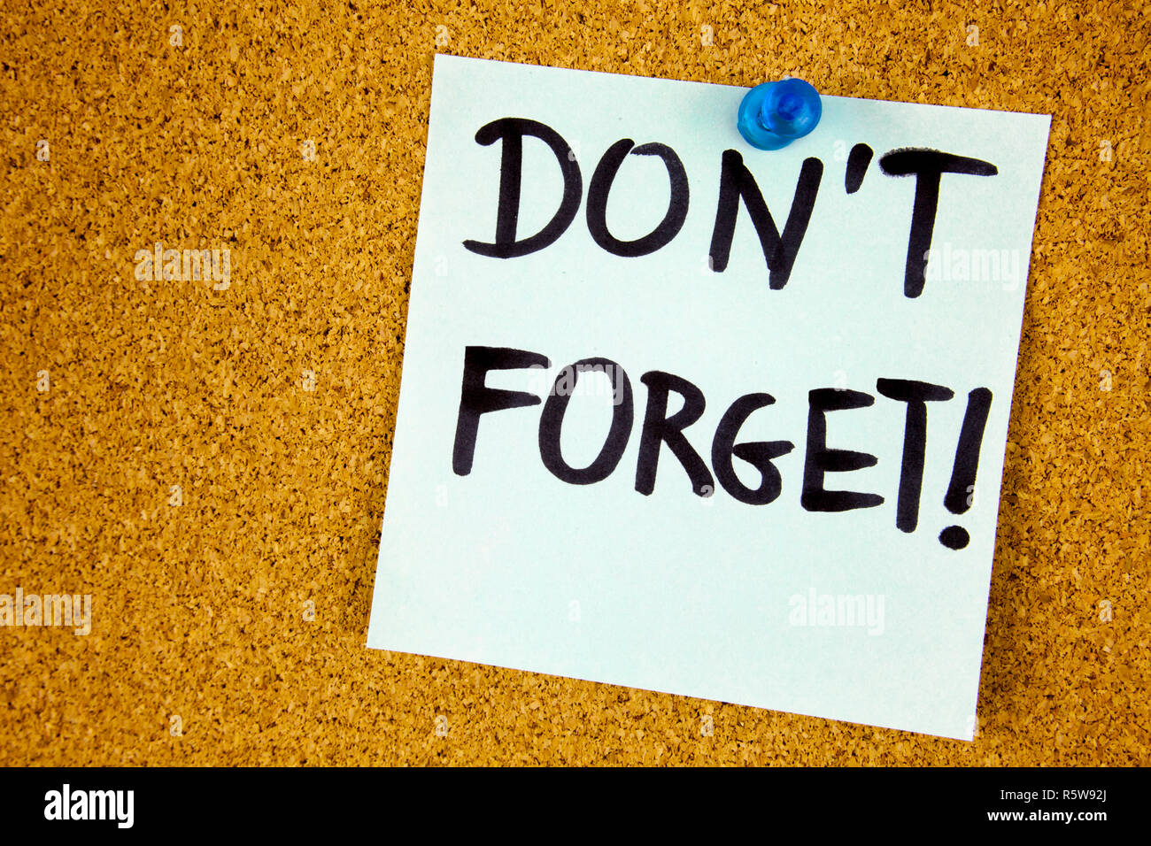 don't forget written on color sticker notes over cork board background ...