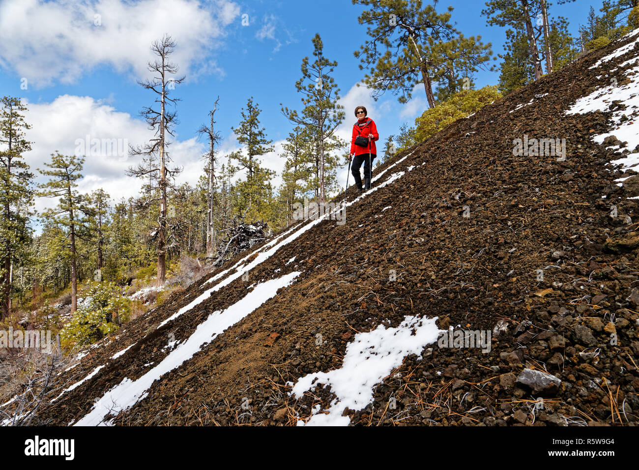42 835 02002 Woman Hiking In Winter Standing On Steep Slope Snowy Black