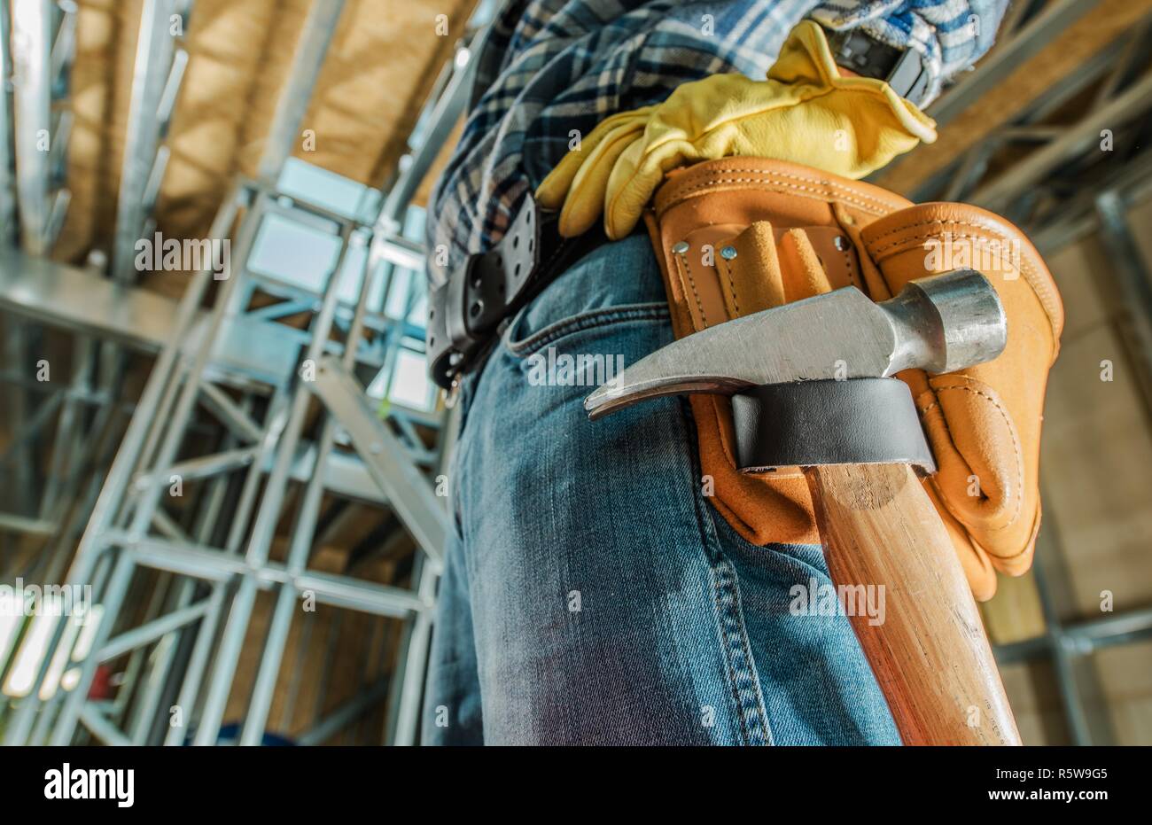 Caucasian Contractor Tools Belt Closeup with a Hammer. Construction ...