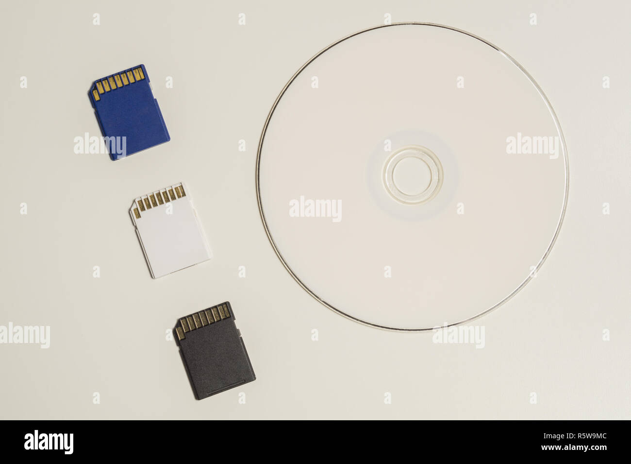 Memory card and digital disc isolated on white background. copy space ...