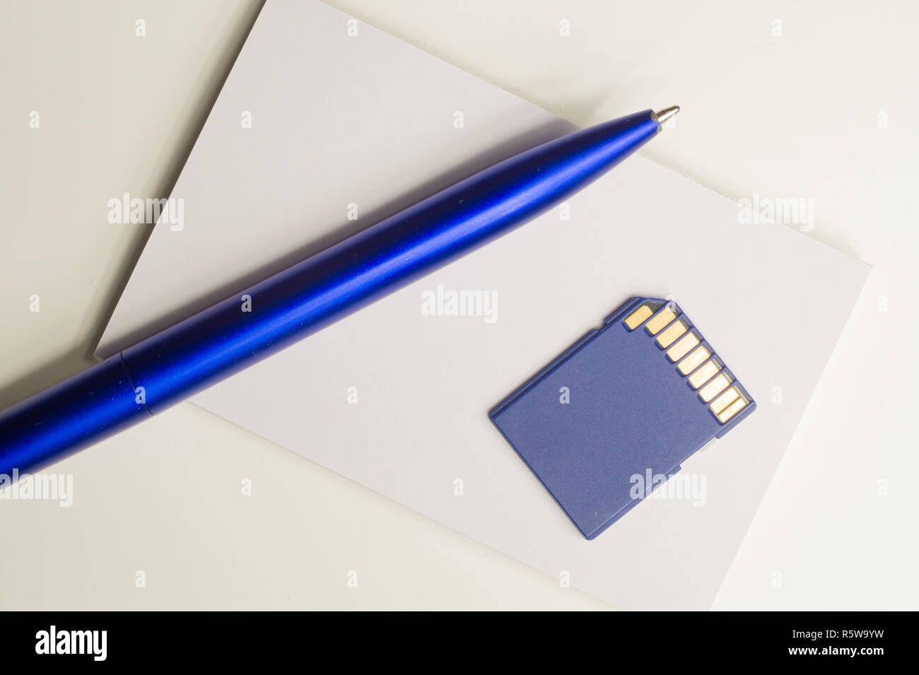 Sd memory card and pen background Stock Photo - Alamy