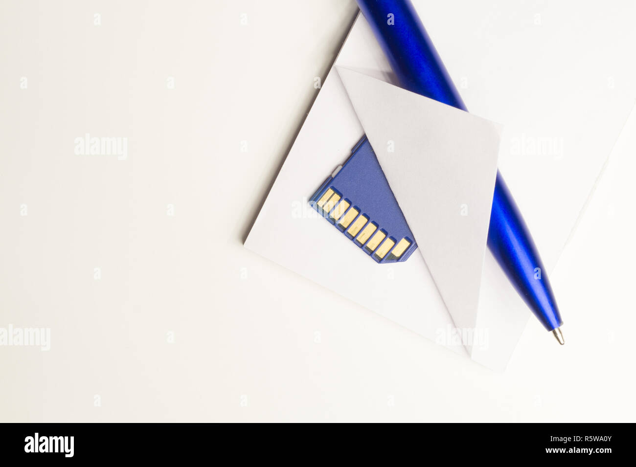 Sd memory card and pen background Stock Photo - Alamy