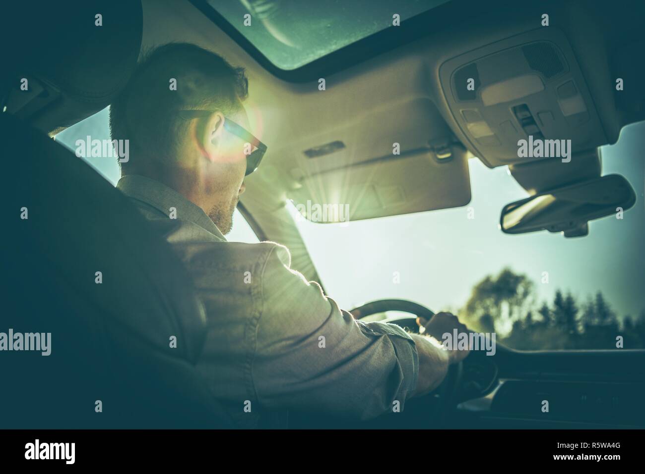 Men Behind the Wheel. Caucasian Men Driving Modern Vehicle. Automotive ...