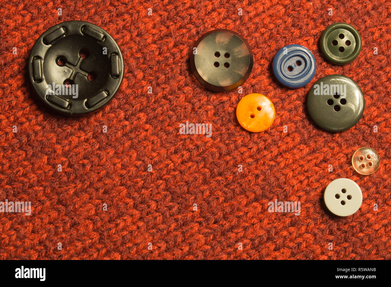 Various sewing buttons on textile background Stock Photo - Alamy
