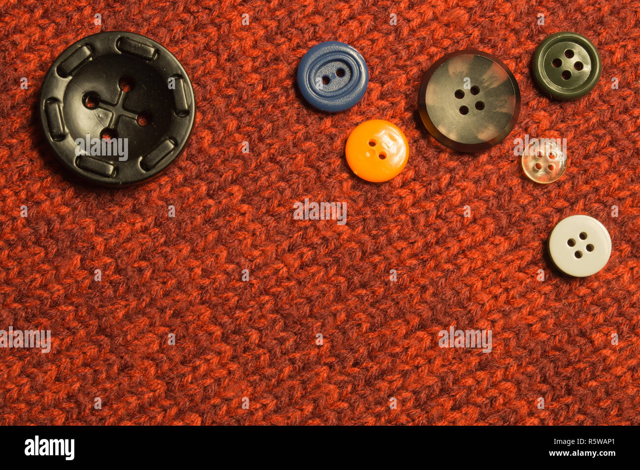 Various sewing buttons on textile background Stock Photo - Alamy