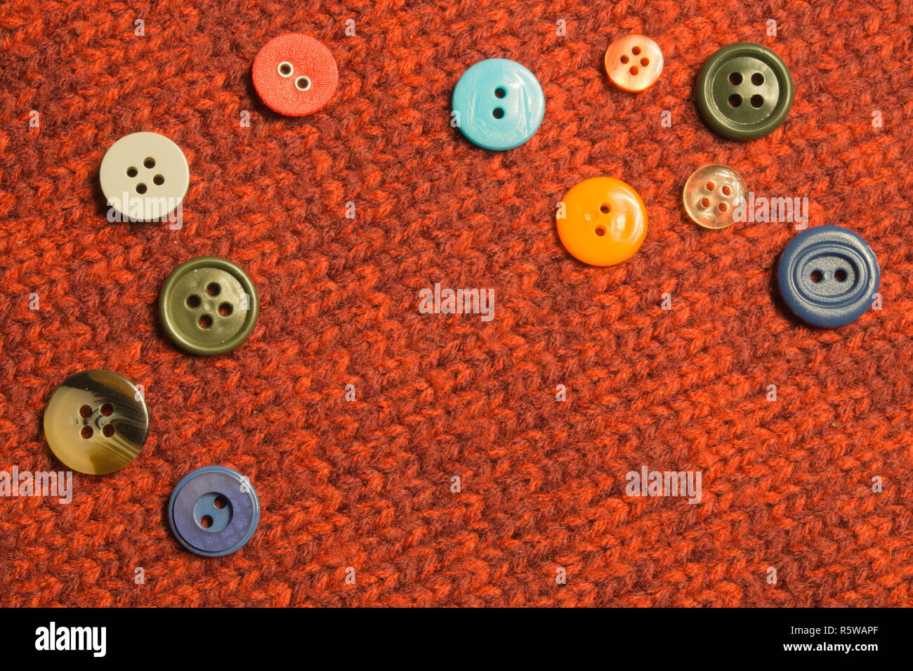 Various sewing buttons on textile background Stock Photo - Alamy
