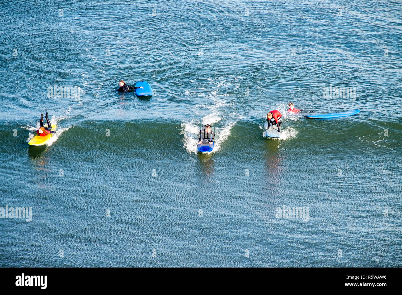 surfers learning to surf Stock Photo - Alamy
