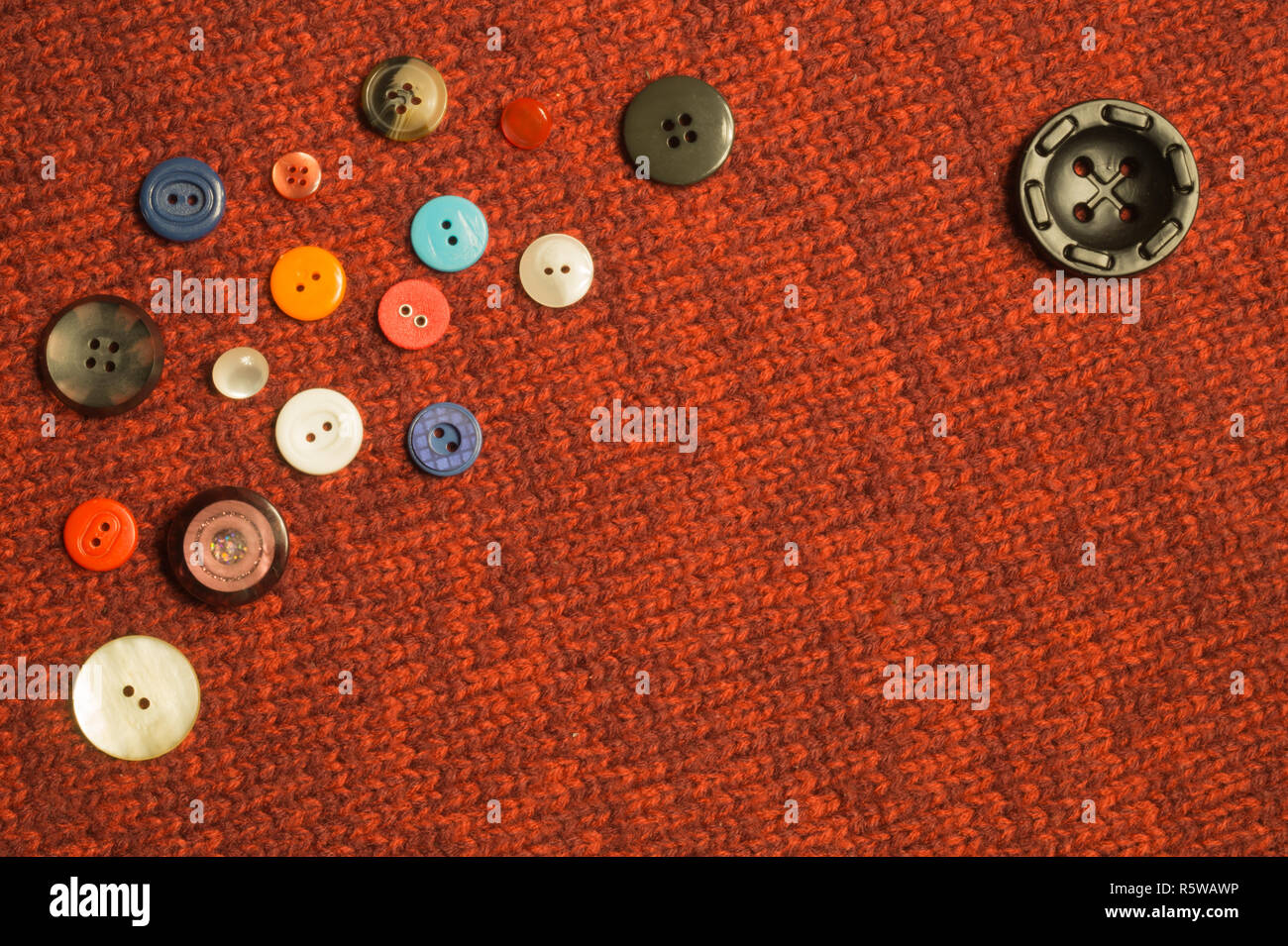 Various sewing buttons on textile background Stock Photo - Alamy