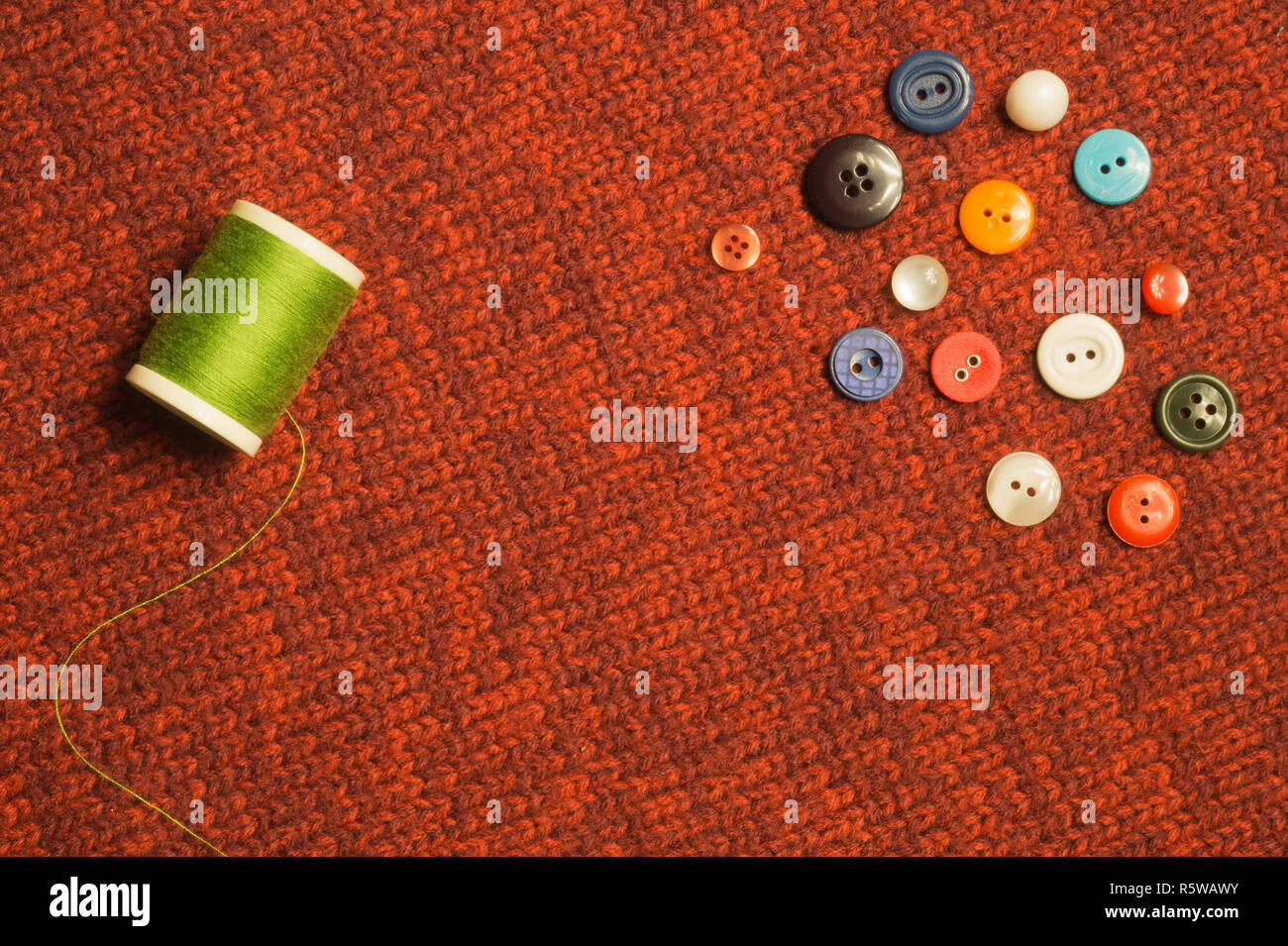 Various sewing buttons on textile background Stock Photo - Alamy