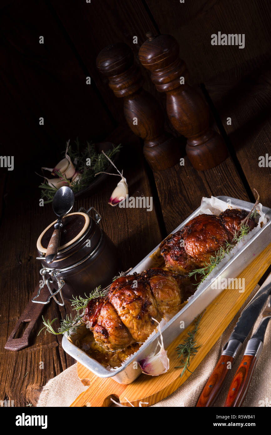 small rolling roast with dried fruit and bacon Stock Photo - Alamy