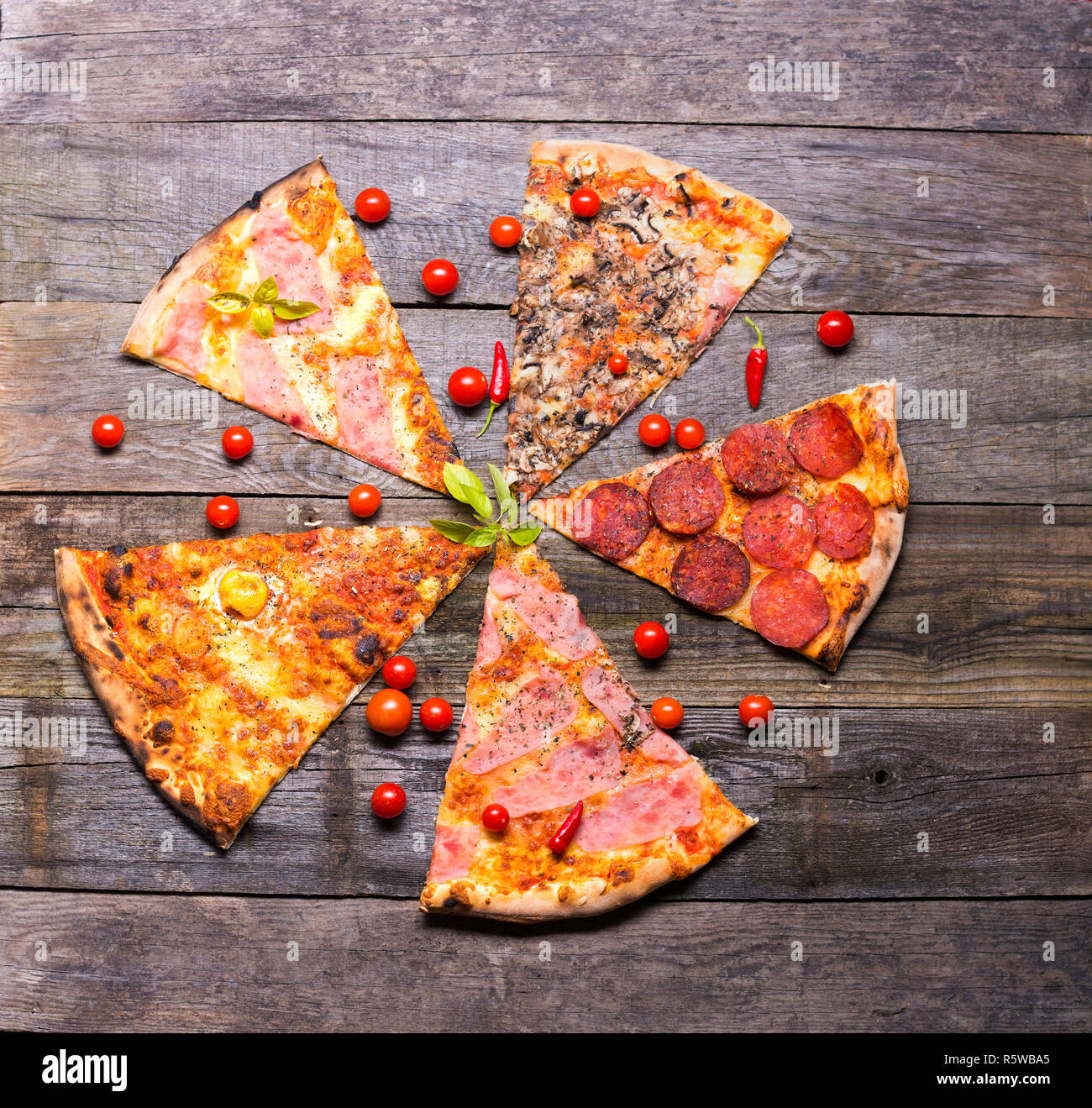 Diferent pizza parts on table, table top view Stock Photo - Alamy