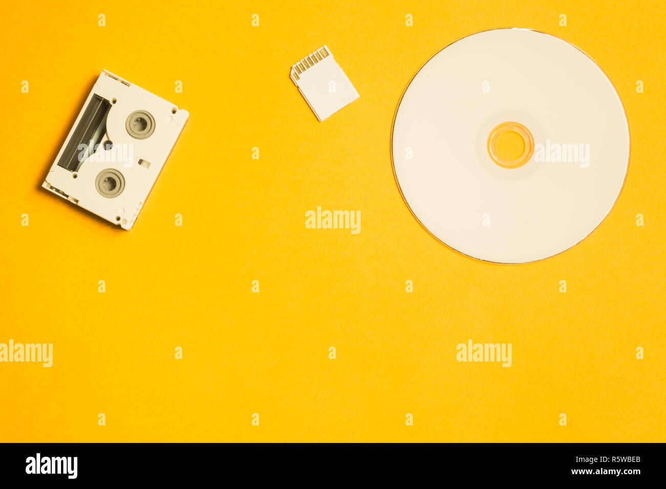 Compact disc and memory card. digital video cassette. copy space Stock ...