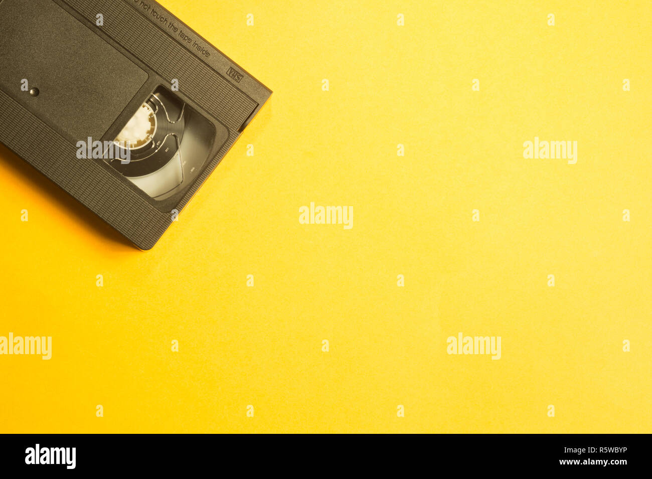 VHS video tape cassette isolated on yellow background Stock Photo - Alamy