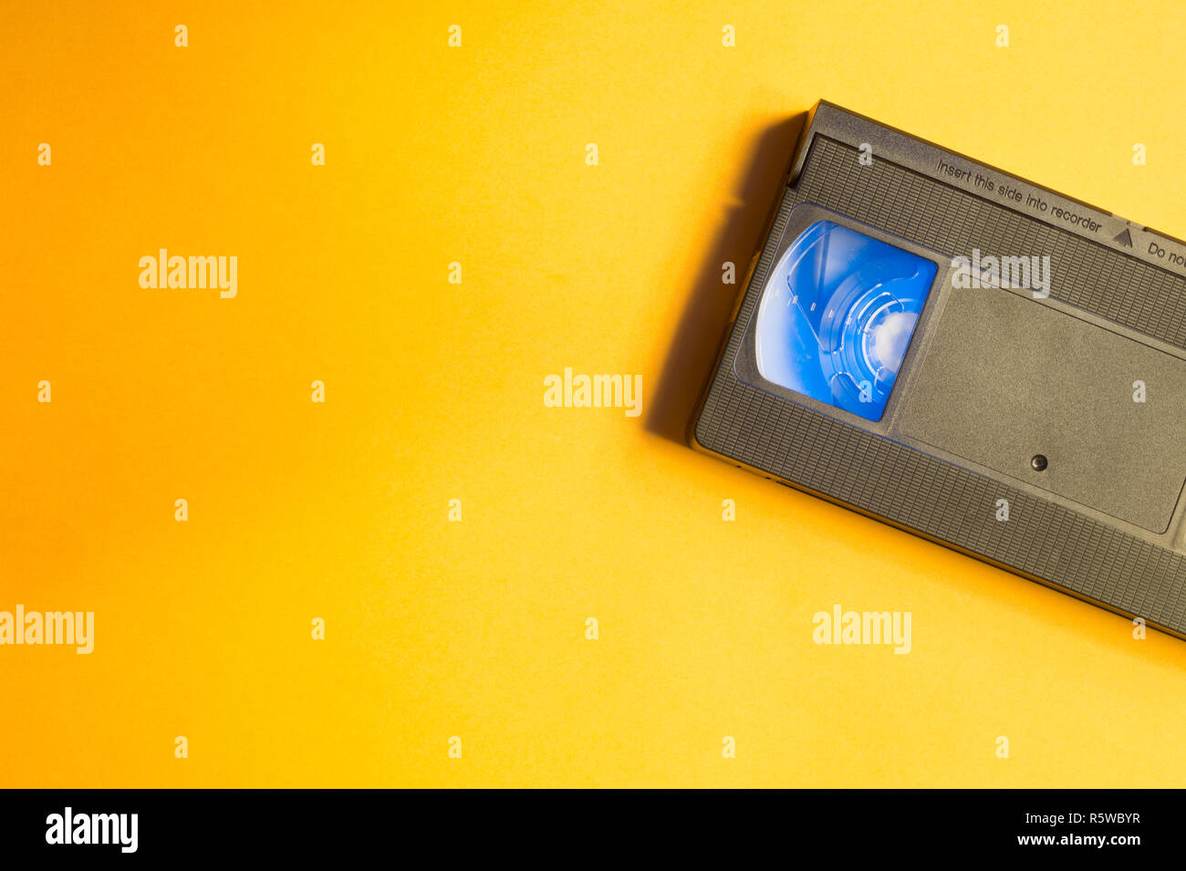VHS video tape cassette isolated on yellow background Stock Photo - Alamy