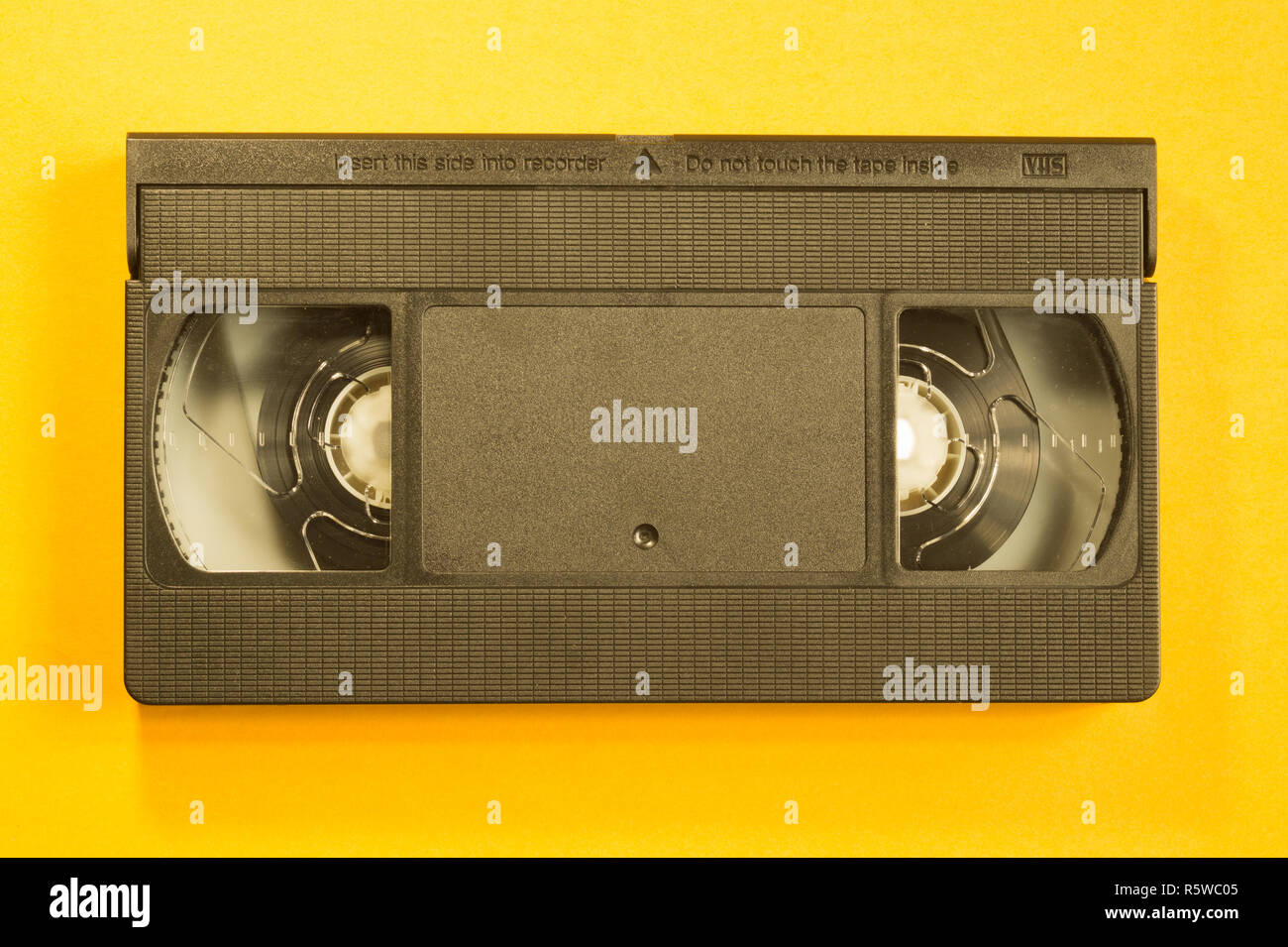 VHS video tape cassette isolated on yellow background Stock Photo - Alamy