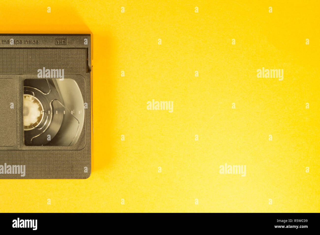 VHS video tape cassette isolated on yellow background Stock Photo - Alamy