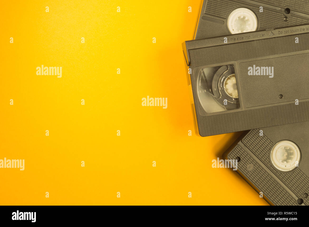 VHS video tape cassette isolated on yellow background Stock Photo - Alamy