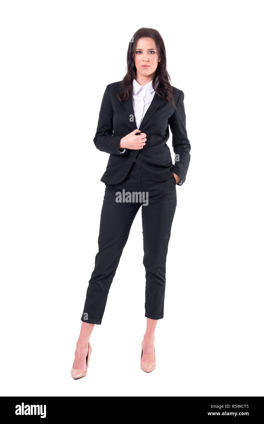 Elegant female corporate manager in business suit posing and holding ...