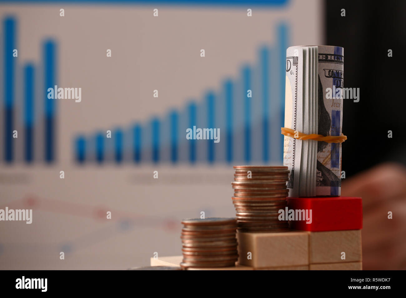 Hand businessman putting pin money Stock Photo - Alamy