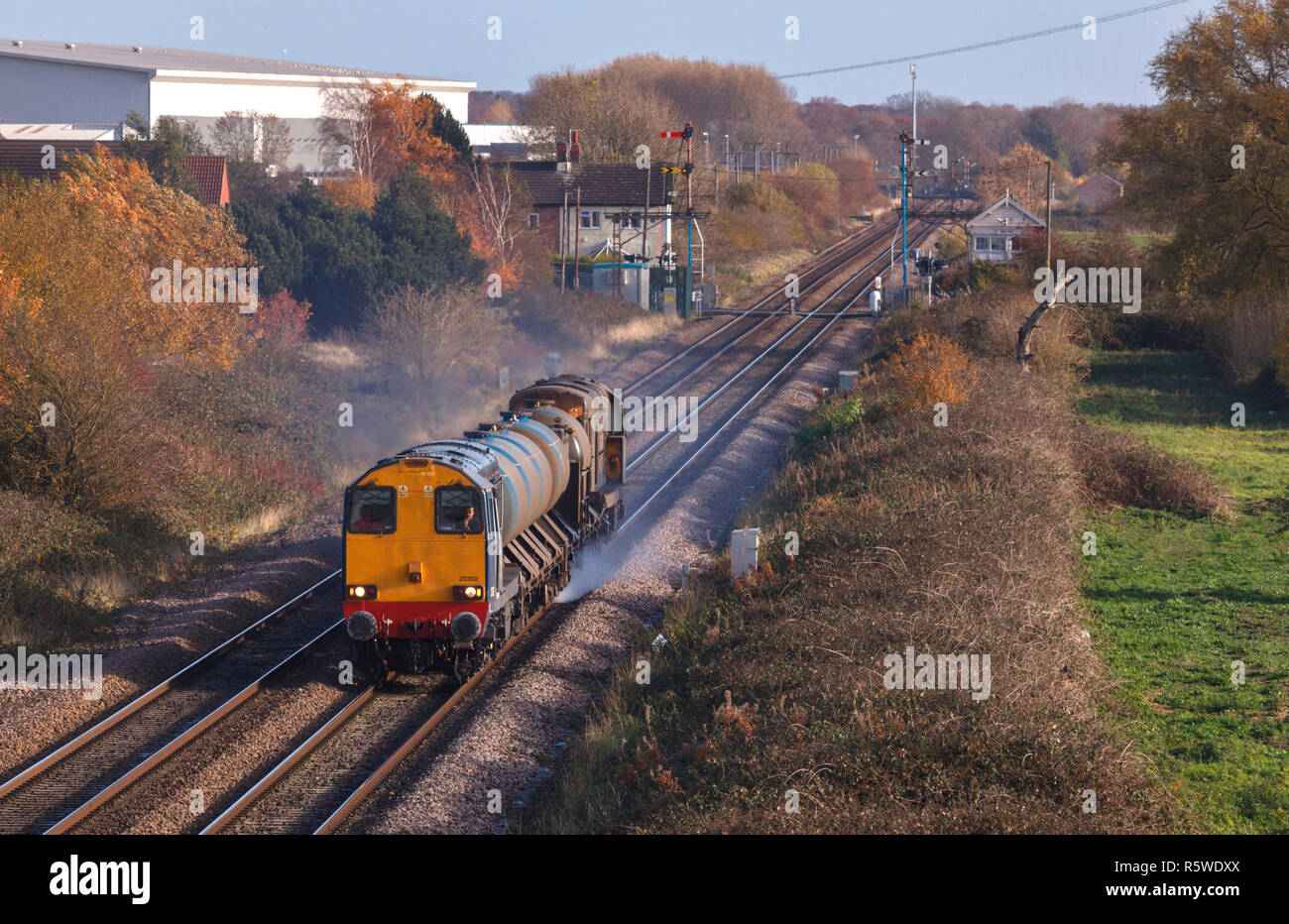 Network Rail railhead Treatment train passing the mechanical signal box ...