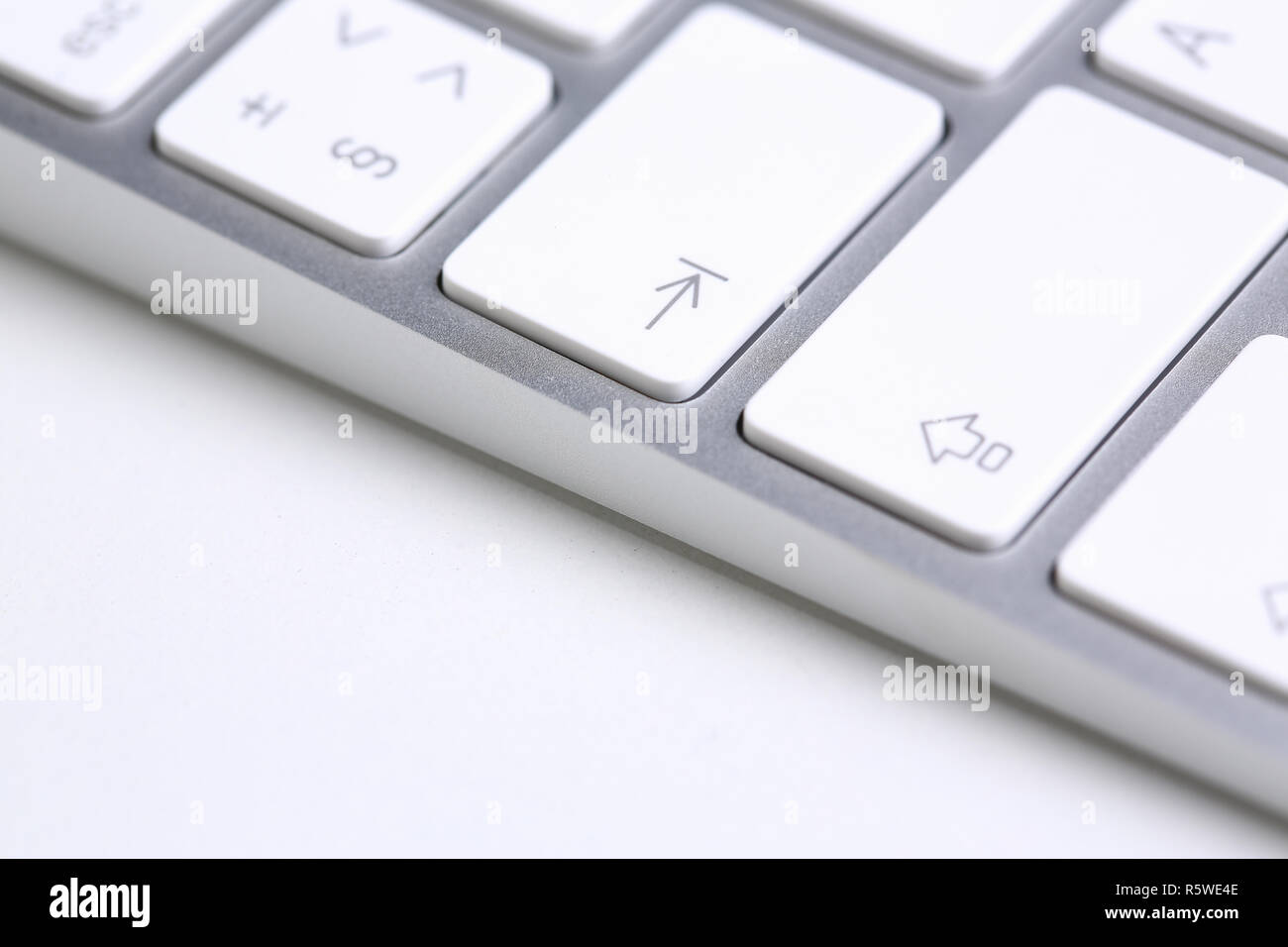 Silver keyboard with white key push button Stock Photo - Alamy