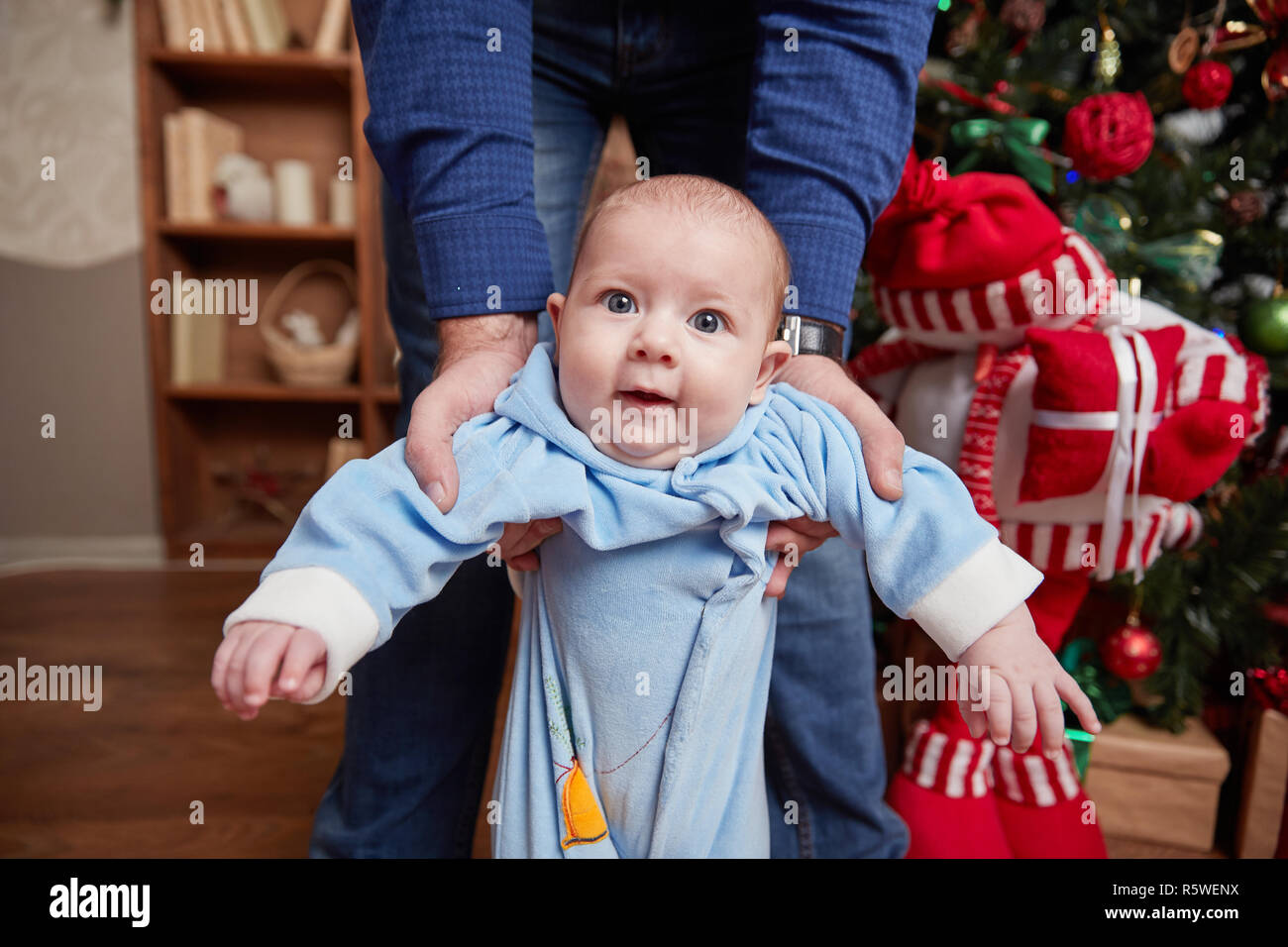 close up. surprised baby taking first steps Stock Photo - Alamy