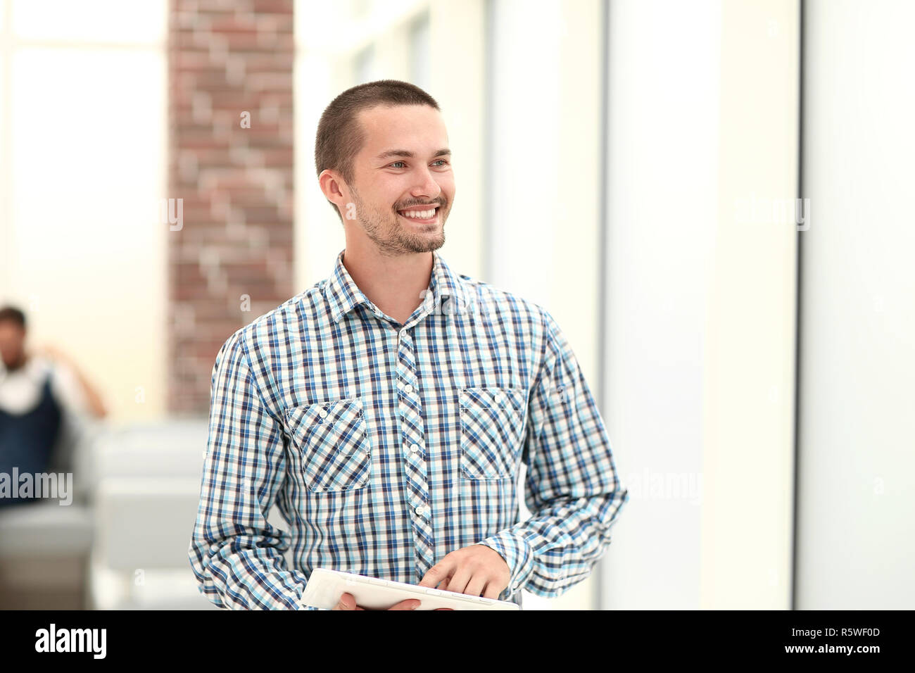modern man standing near the office window Stock Photo - Alamy