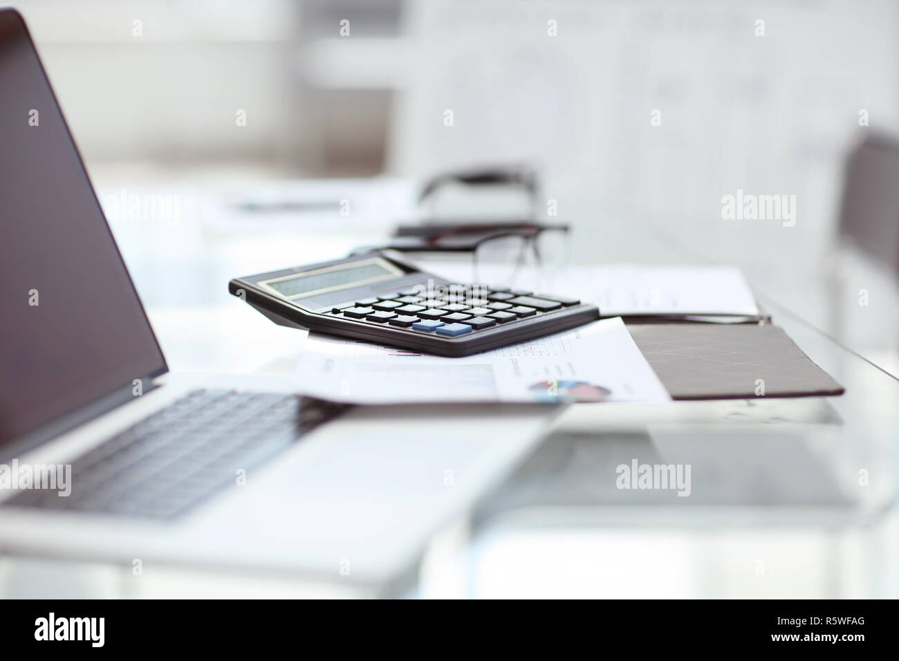 close up. laptop and calculator on the Desk in the office Stock Photo ...