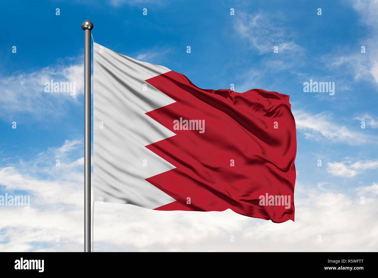 Flag of Bahrain waving in the wind against white cloudy blue sky ...
