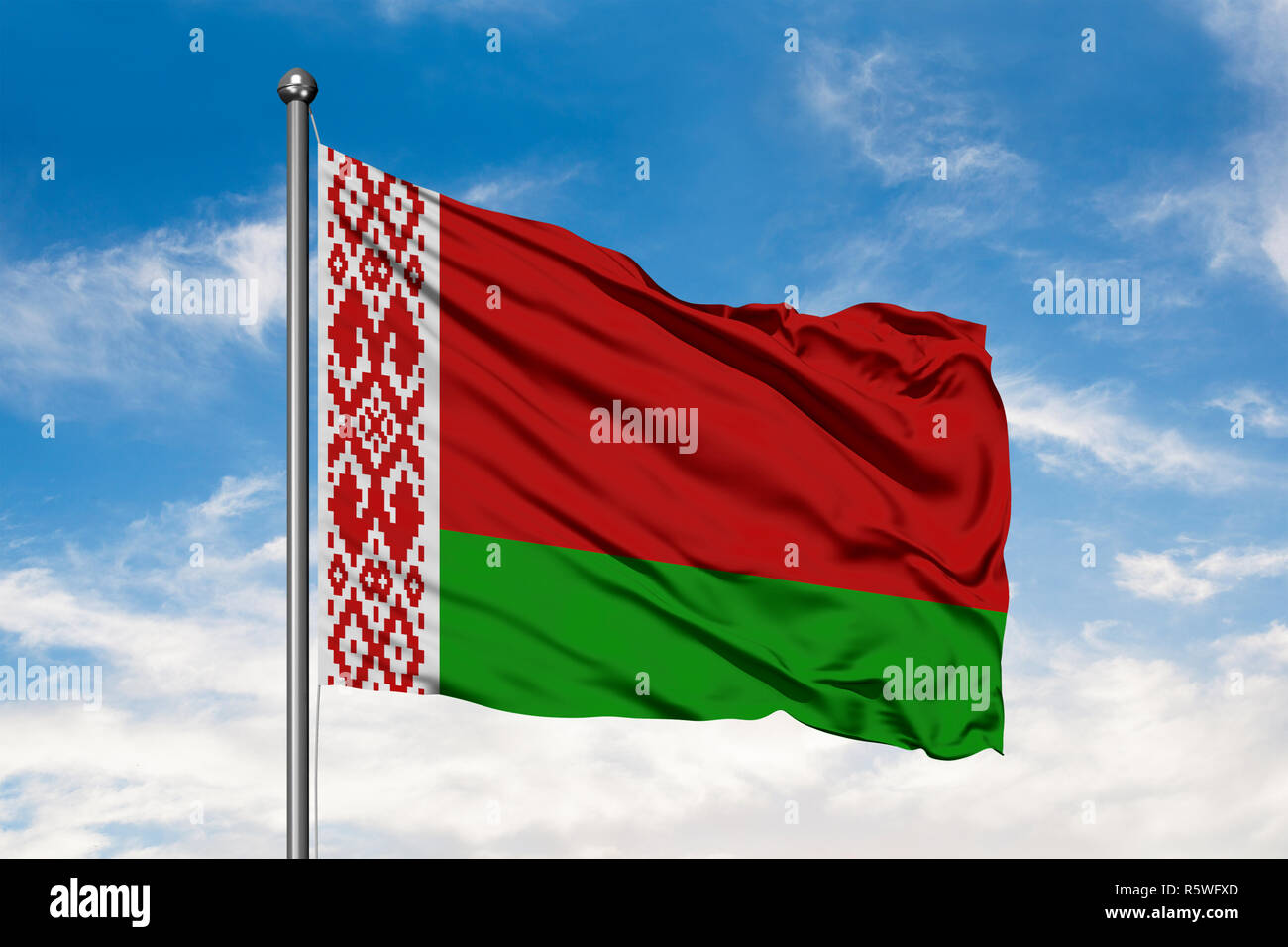Flag of Belarus waving in the wind against white cloudy blue sky ...