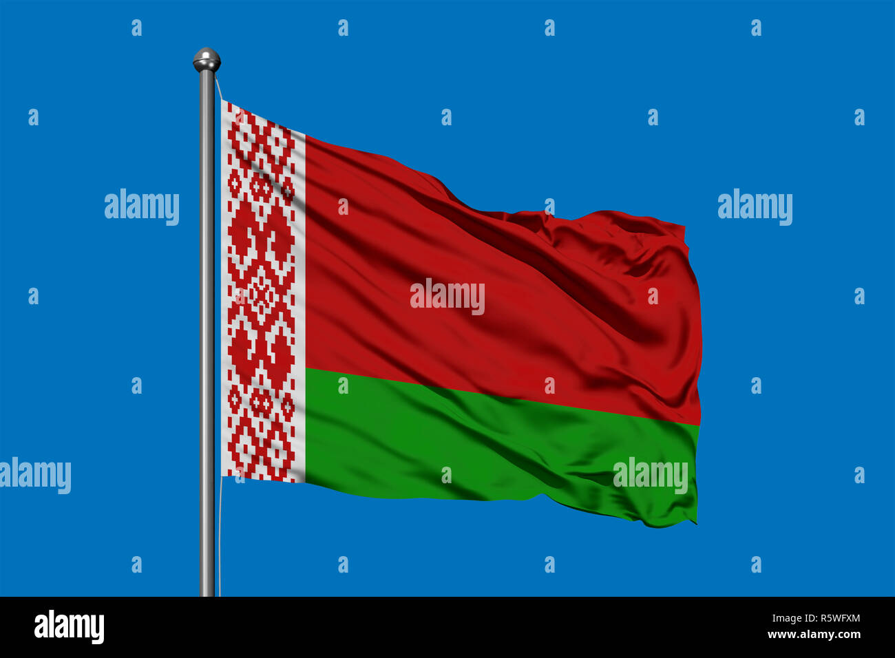 Flag of Belarus waving in the wind against deep blue sky. Belarusian ...