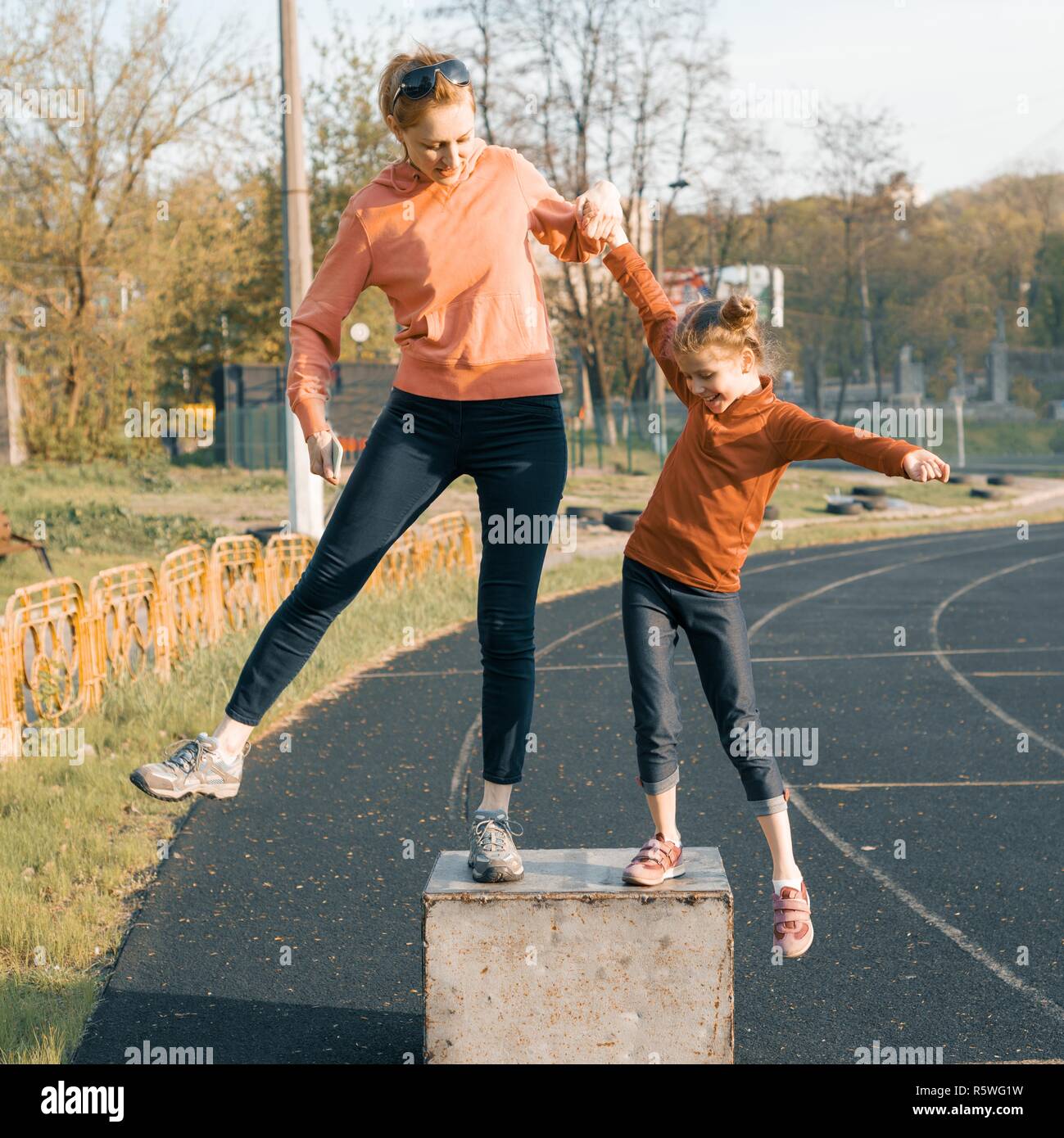 Sports cheerful family, healthy lifestyle, spring portrait of mother ...