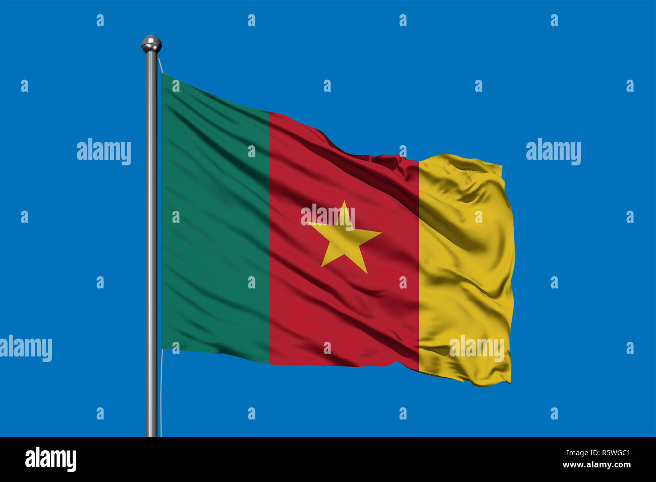 Flag of Cameroon waving in the wind against deep blue sky. Cameroonian ...